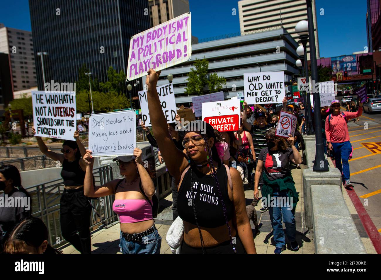 People marching in a pro-choice march with placards. Protestors ...