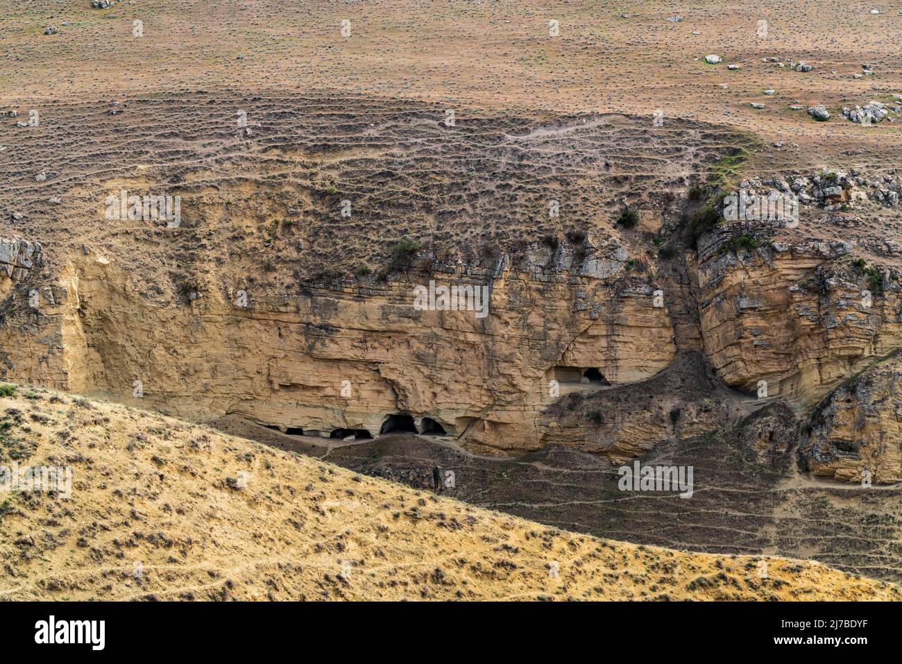 Ancient caves in the mountain Stock Photo - Alamy