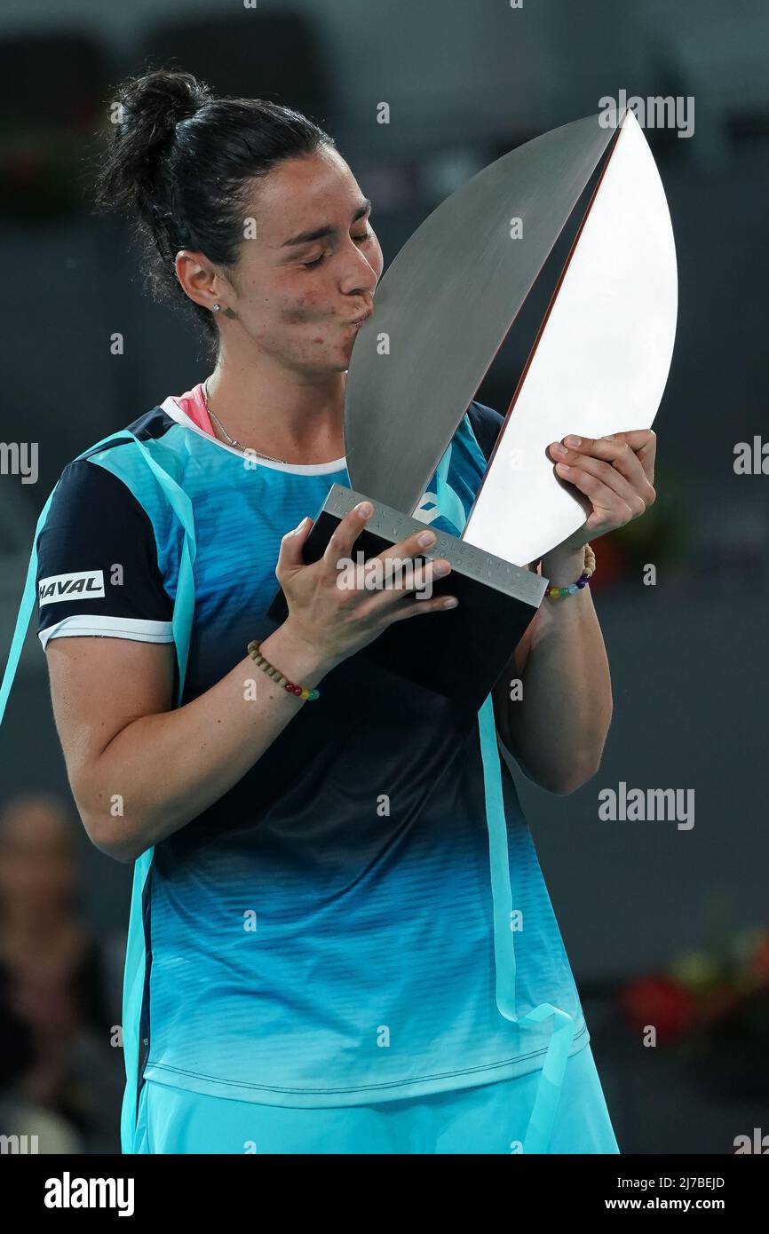 Ons Jabeur of Tunisia celebrates with the trophy following victory ...