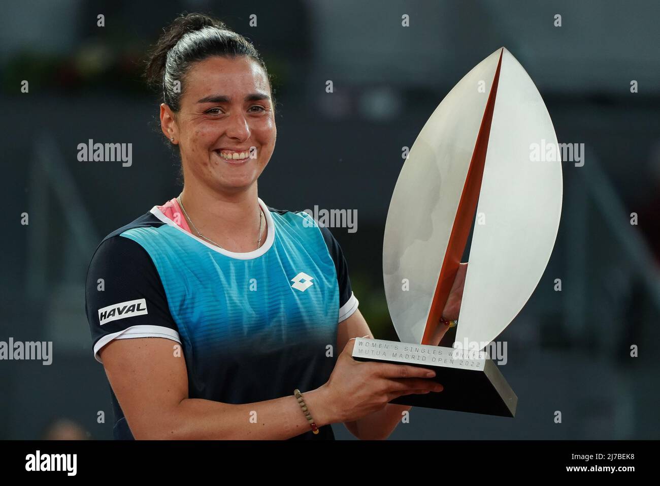 Ons Jabeur of Tunisia celebrates with the trophy following victory ...