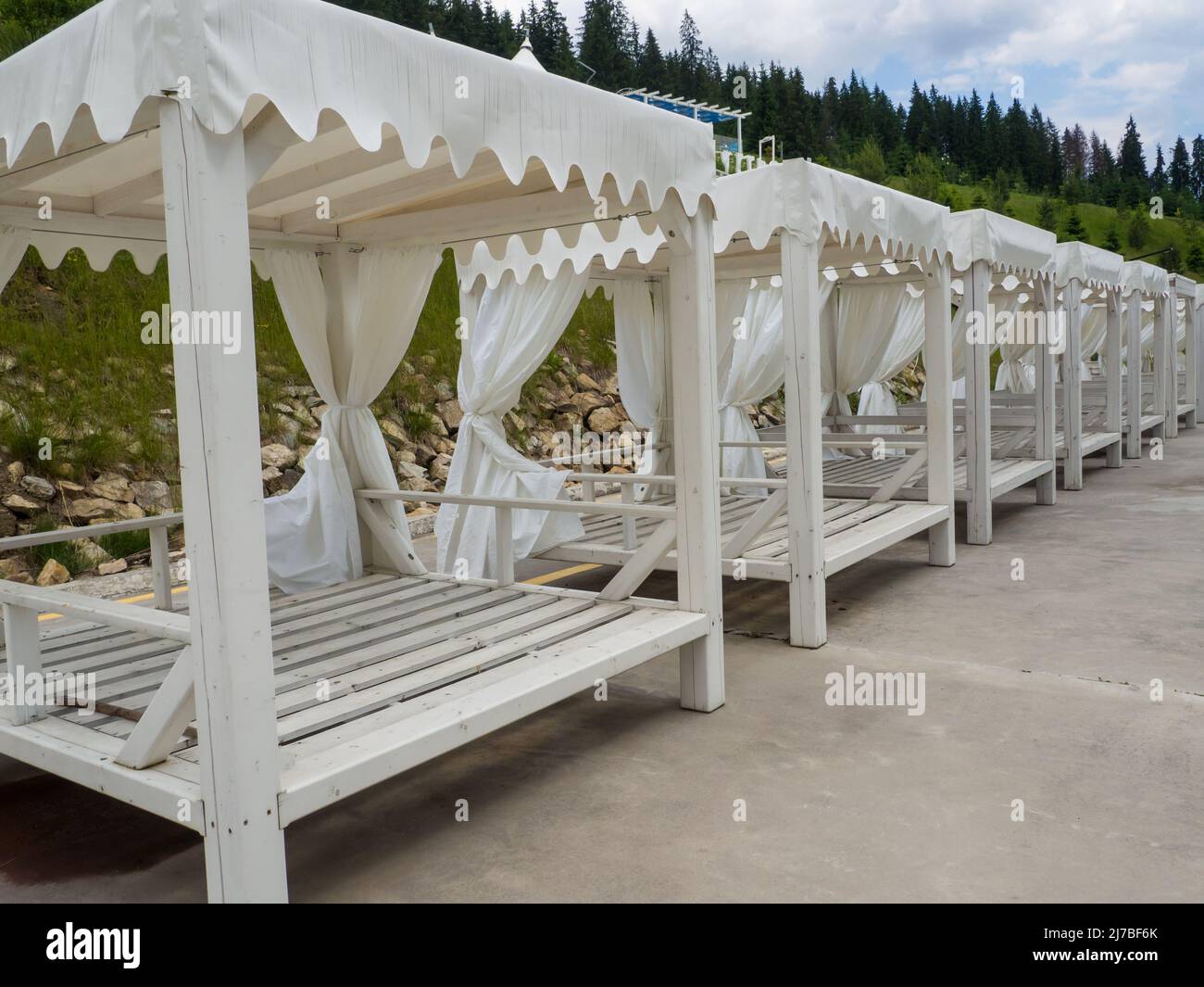 Empty sun loungers stand under a canopy Stock Photo - Alamy