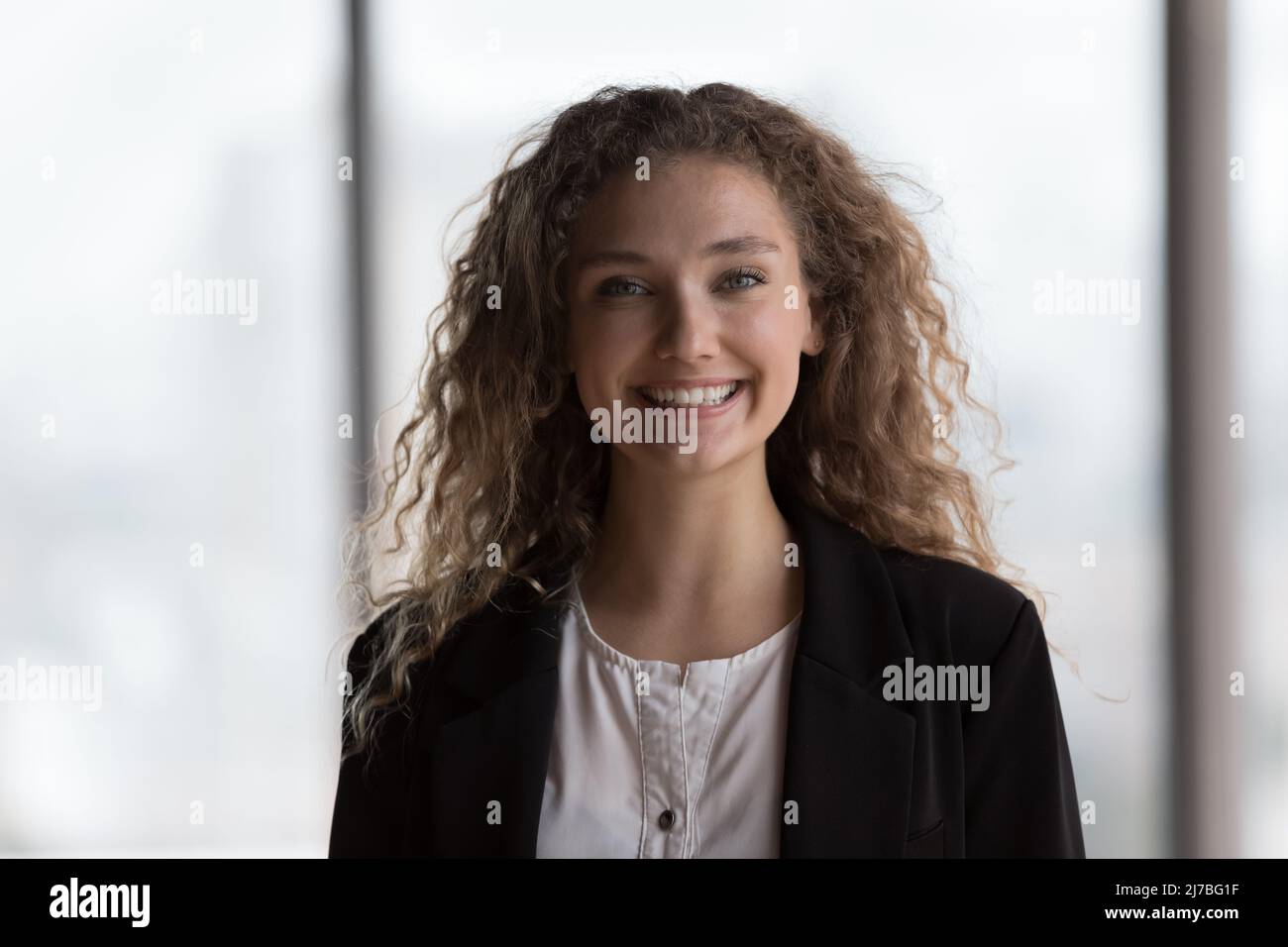 Happy young intern girl looking at camera, smiling, getting job Stock ...