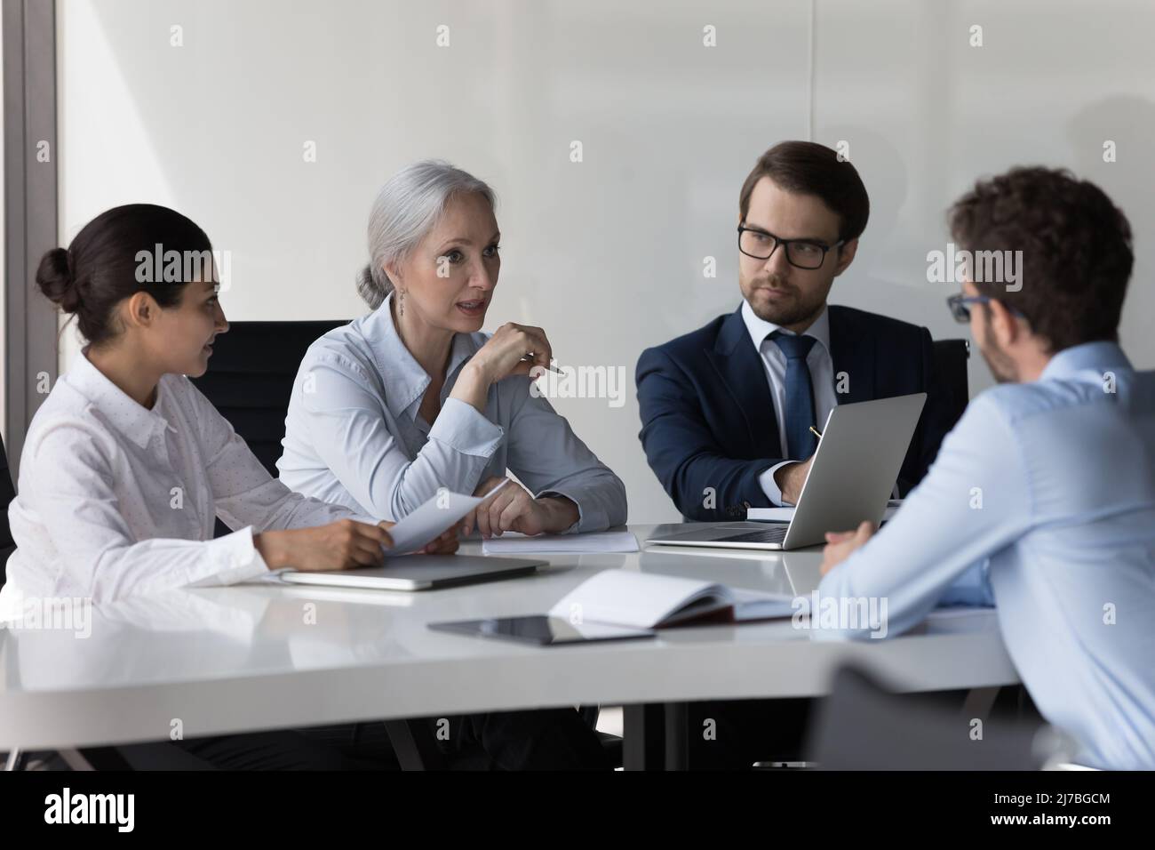 Diverse recruit team meeting, talking to job candidate for interview ...