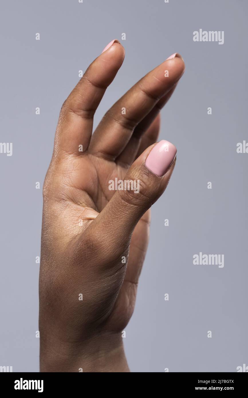 Black women's hand with a beautiful manicure Stock Photo - Alamy
