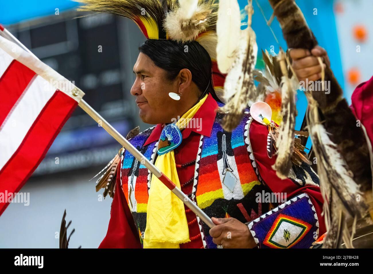 The American flag and Eagle staff lead the beginning of a Red Dress ...