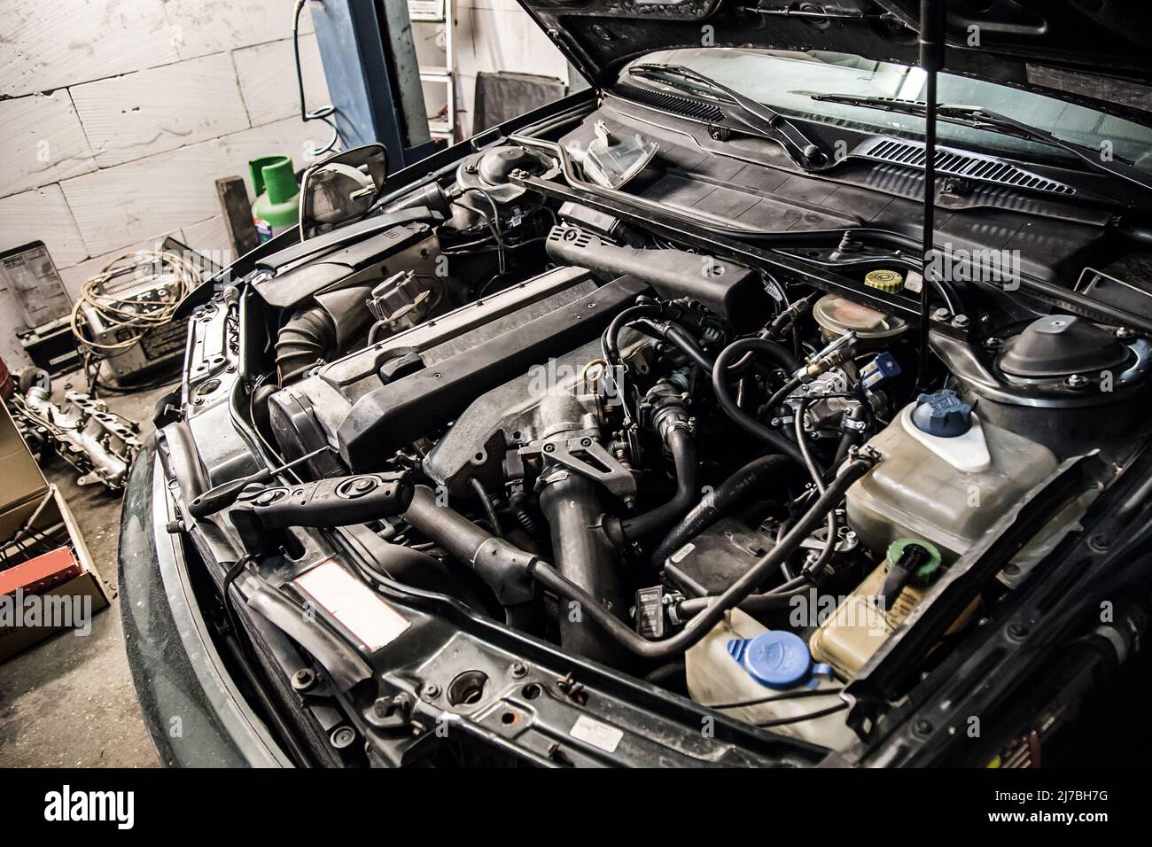 Old car with an open hood in service Stock Photo - Alamy