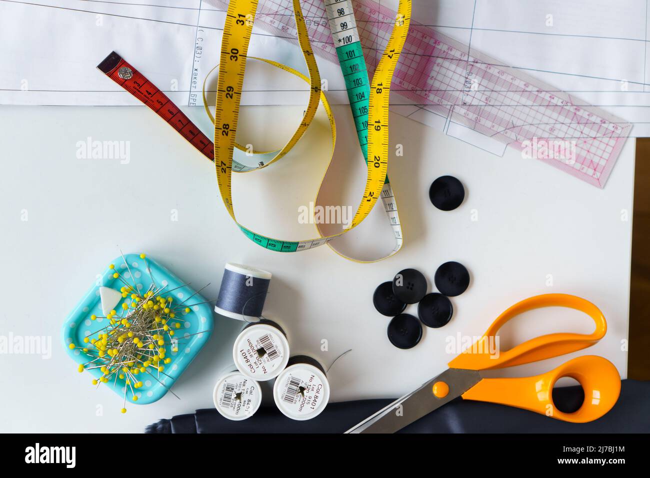 Sewing items and seamstress tools. Scissors, measuring tape, threads ...