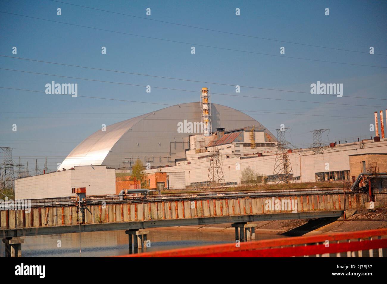 View of the Chernobyl New Safe Confinement and electrical substation ...