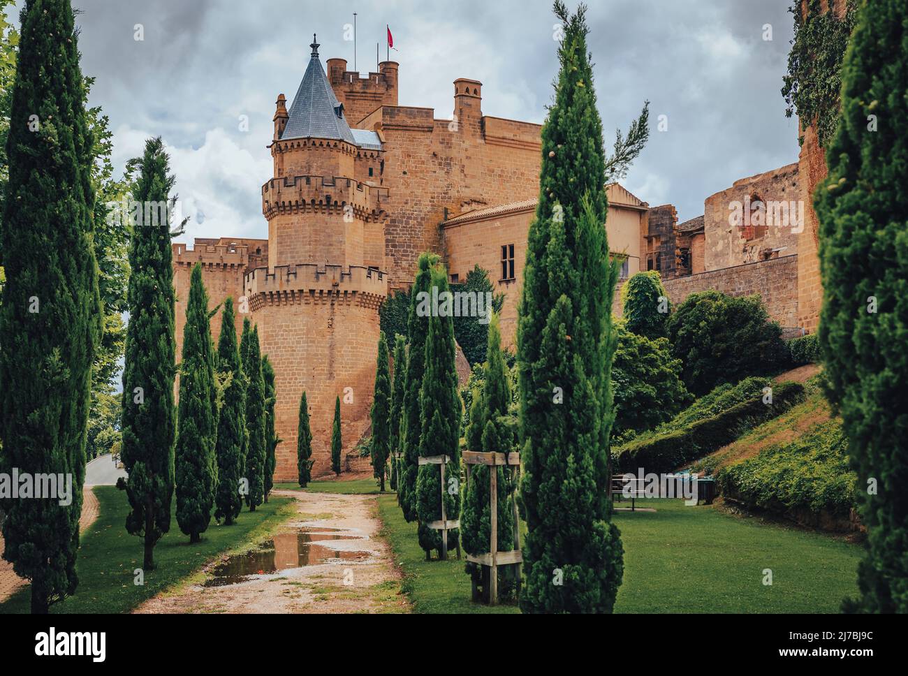 Cypress tree lined alley leading to the ornate gothic palace of the ...