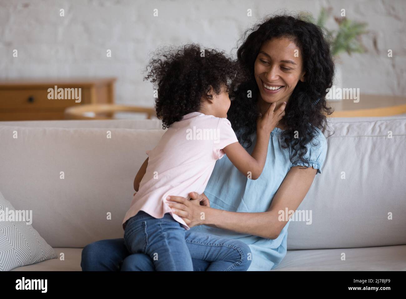 Active preschool African kid tickling happy cheerful mom Stock Photo - Alamy