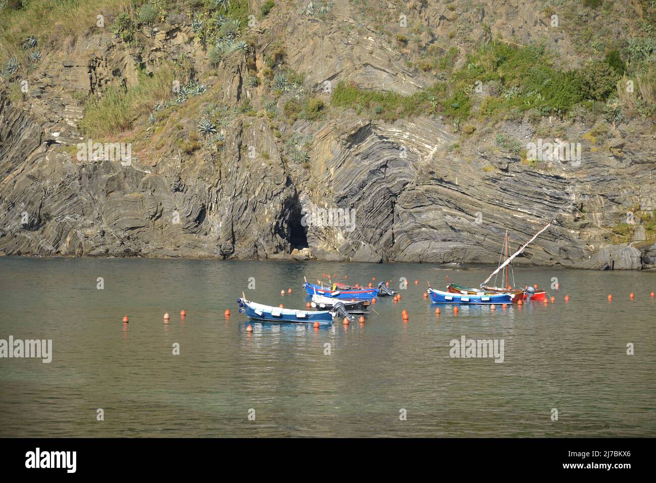 Fishing boats at anchor at Vernazza one of the five villages of the ...