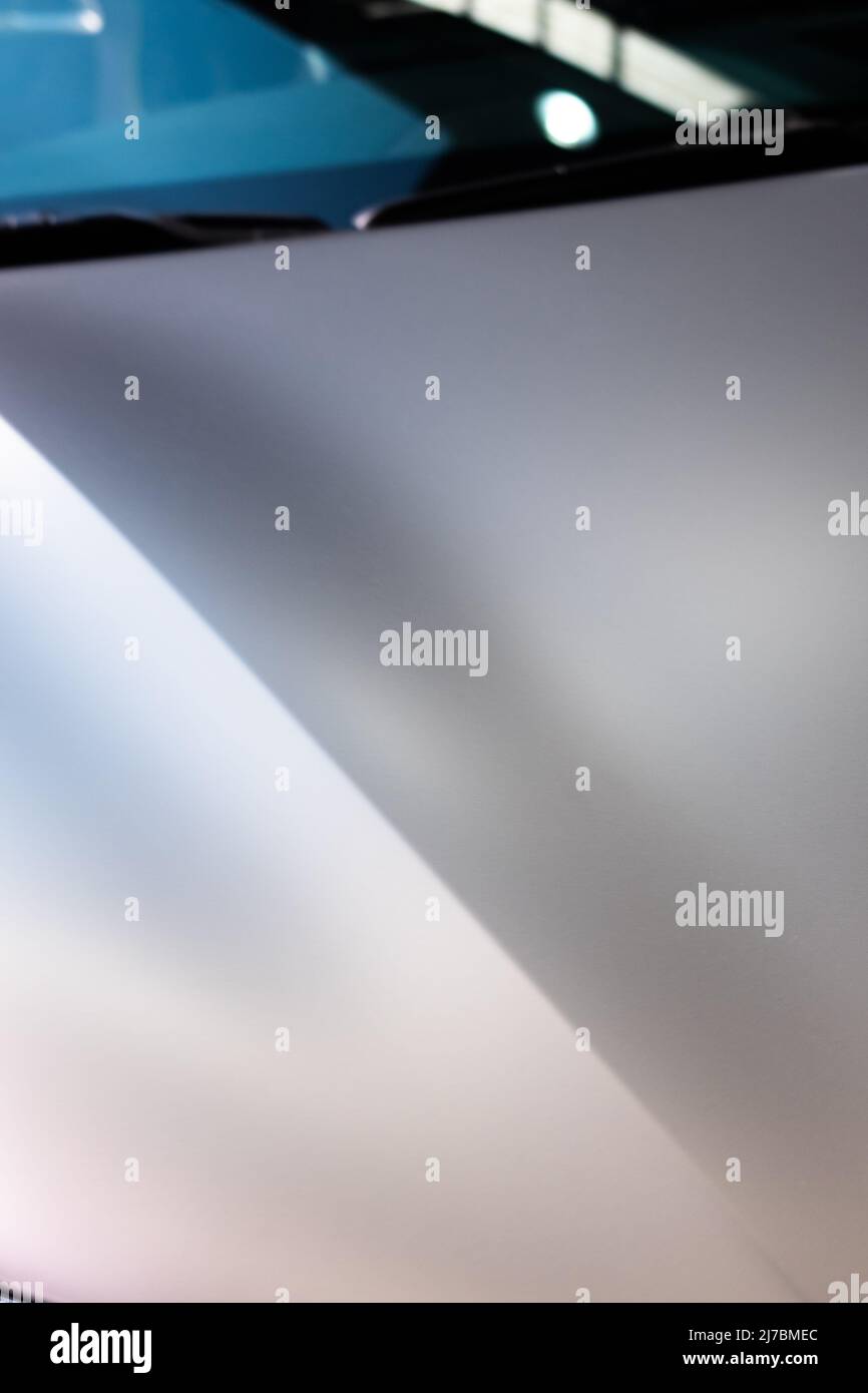 Closeup of the hood of a modern car with bends on matte surface Stock ...