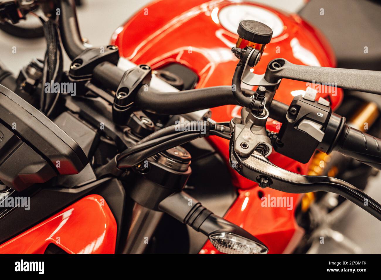 Detail of the handlebar of a custom motorbike with the brakes and turn ...