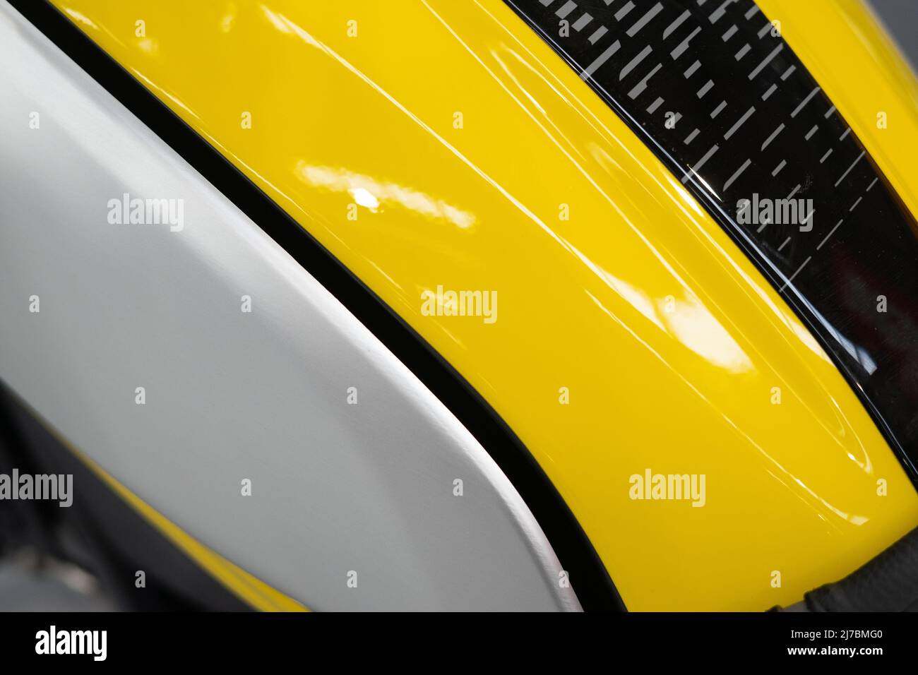 Metallic texture on white, black and yellow with reflections, on a ...