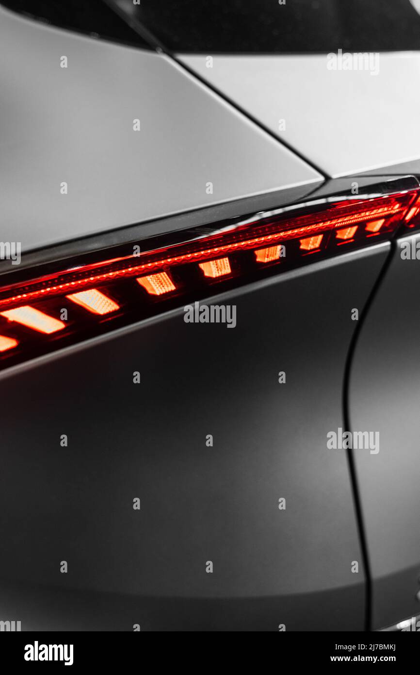 ultra modern matte metal texture with curved shapes and a red plastic ...