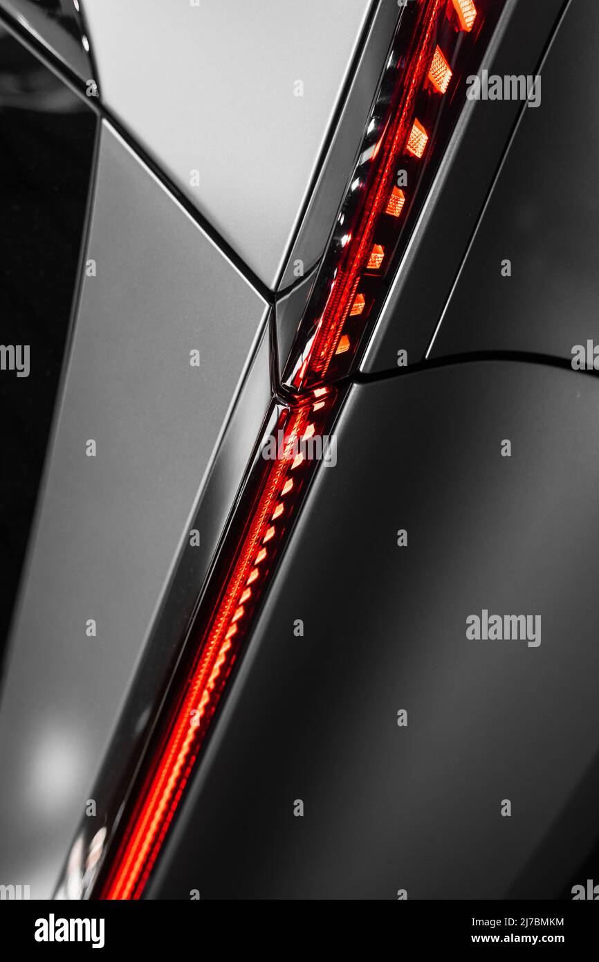 ultra modern matte metal texture with curved shapes and a red plastic ...