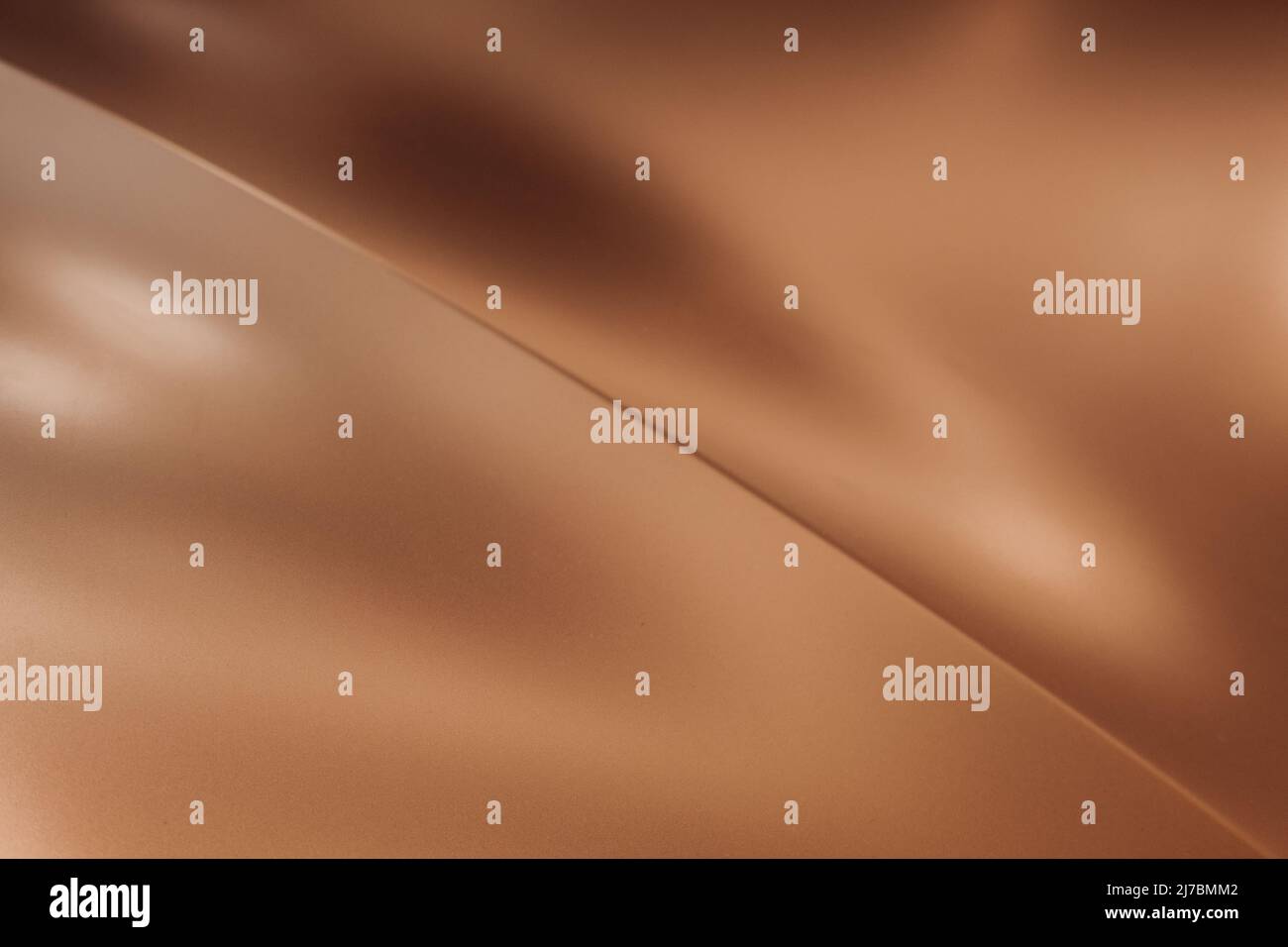 Copper matte metallic texture with a diagonal bend and reflections ...