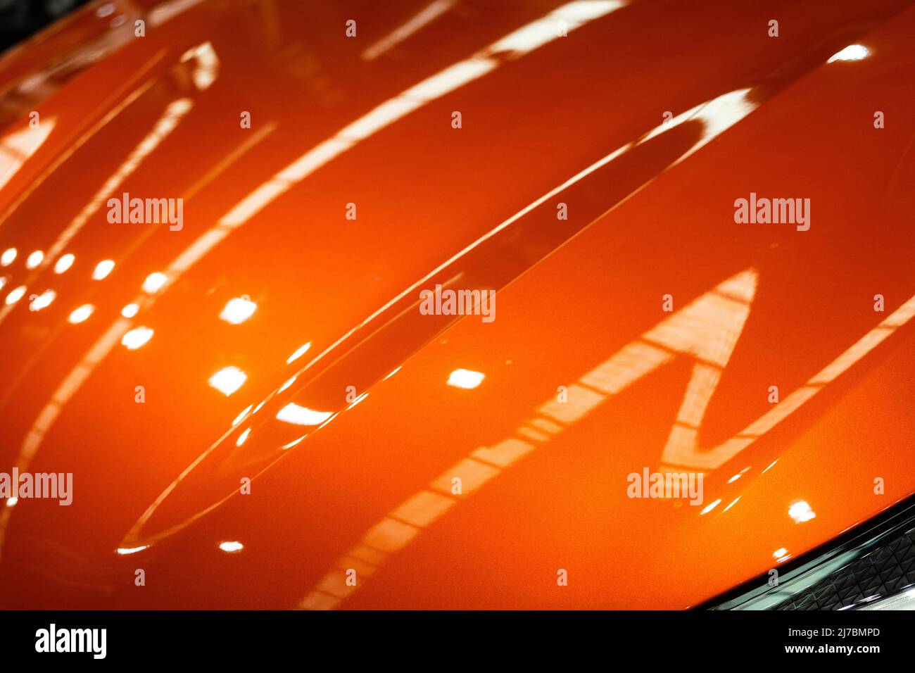 Metallic curved shiny orange texture with reflections Stock Photo - Alamy