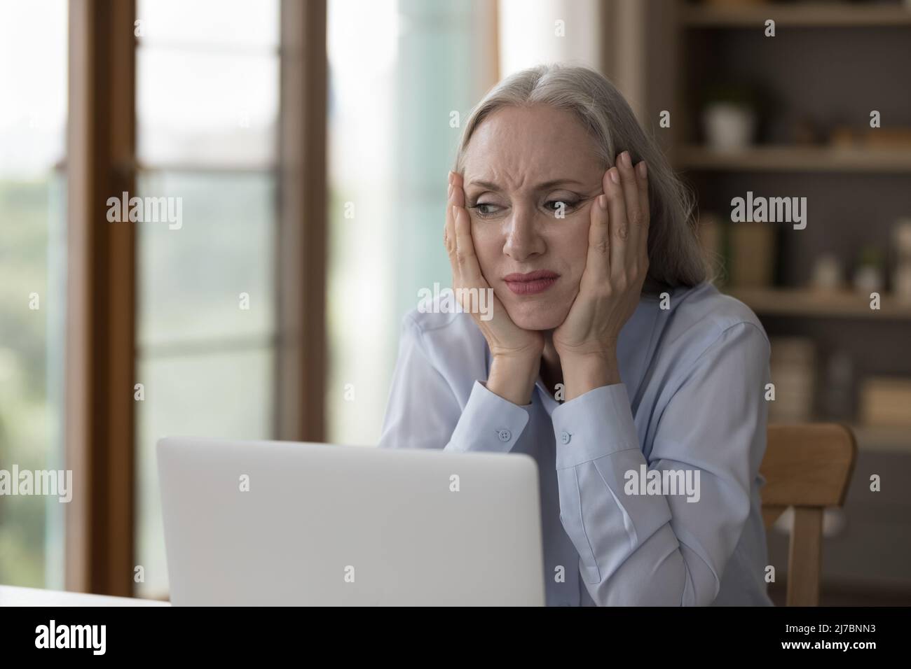 Frustrated unhappy senior business woman annoyed with bad computer work ...