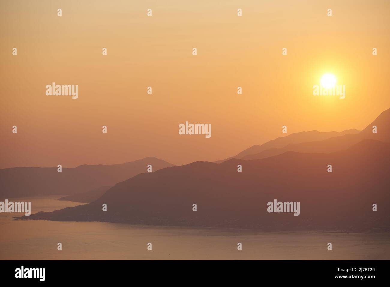 Landscape with sunset, sea and mountains in Montenegro Stock Photo - Alamy