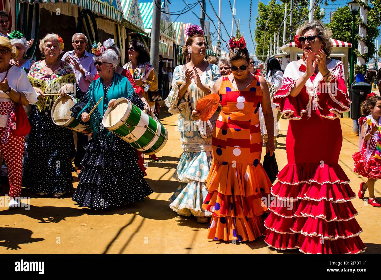 Seville, Spain - May 05, 2022 Sevillians dressed in traditional ...