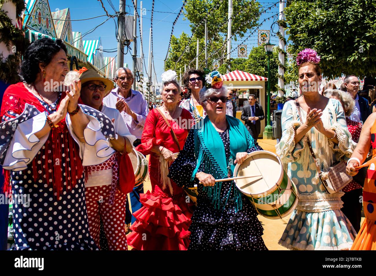 Seville, Spain - May 05, 2022 Sevillians dressed in traditional ...