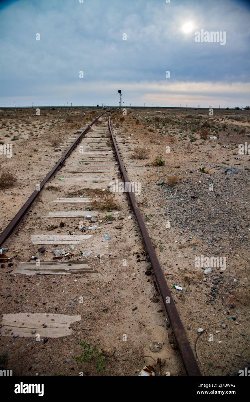 Abandoned railroad line in desert. Rusted rails and wooden sleepers ...