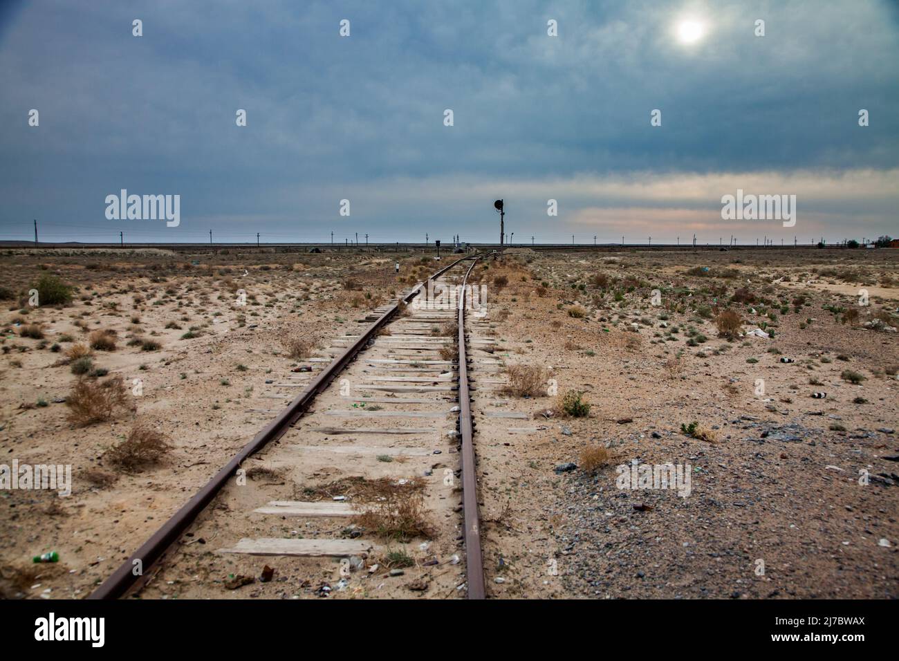 Abandoned railroad line in desert. Rusted rails and wooden sleepers ...