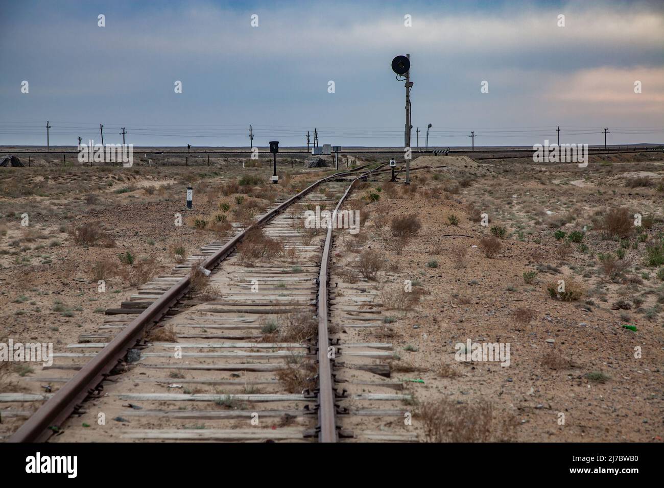 Abandoned railroad line in desert. Rusted rails and wooden sleepers ...
