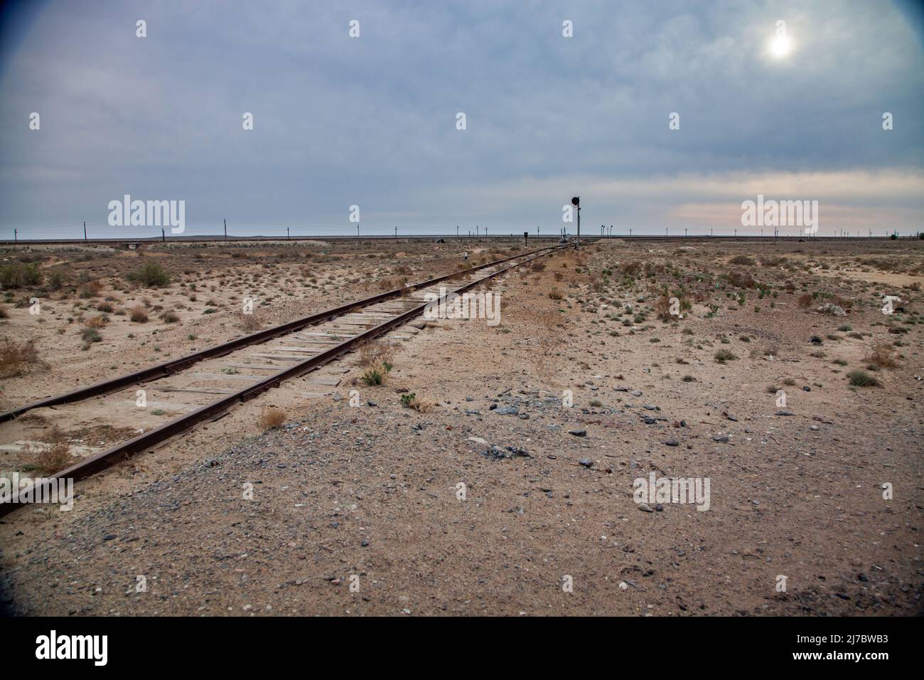 Abandoned railroad line in desert. Rusted rails and wooden sleepers ...