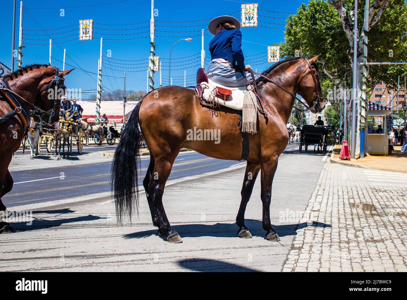 Seville, Spain - May 05, 2022 Sevillian riders dressed in the ...