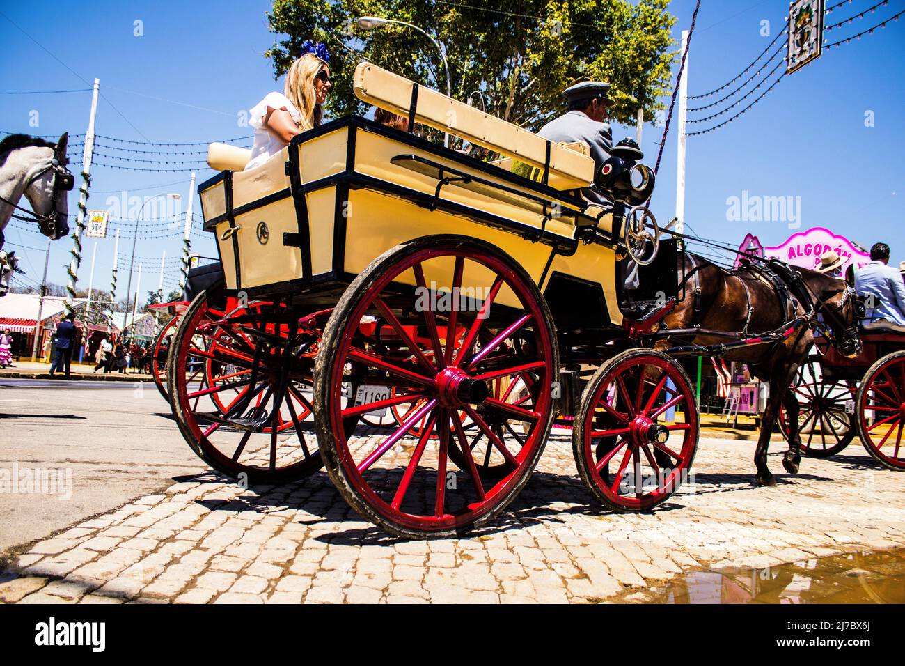 Seville, Spain - May 05, 2022 Sevillians dressed in the traditional ...