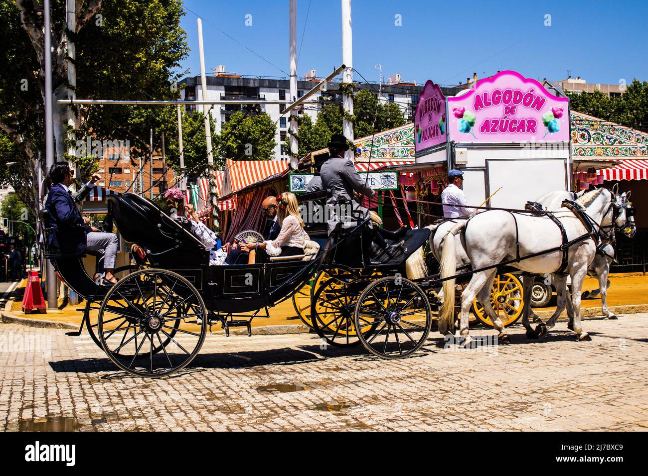 Seville, Spain - May 05, 2022 Sevillians dressed in the traditional ...
