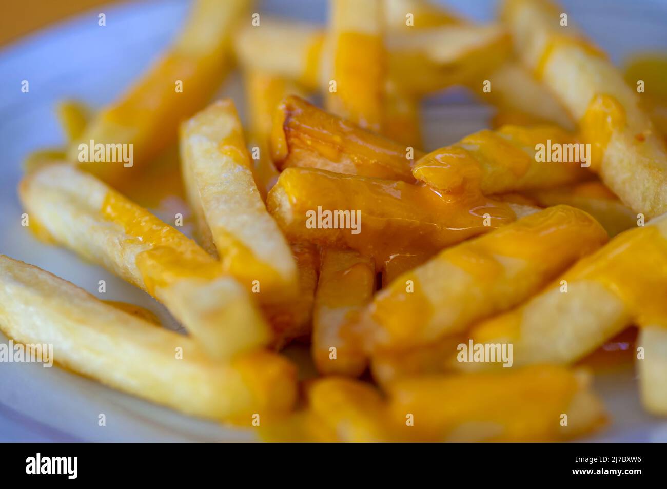 French fries with mayonnaise, in shallow focus Stock Photo - Alamy