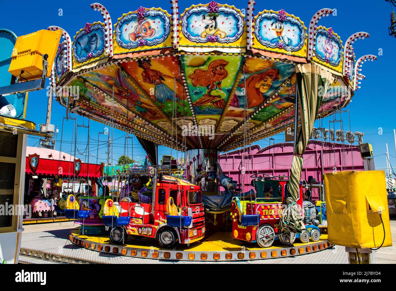 Seville, Spain - May 05, 2022 Feria de Sevilla funfair, the attractions ...