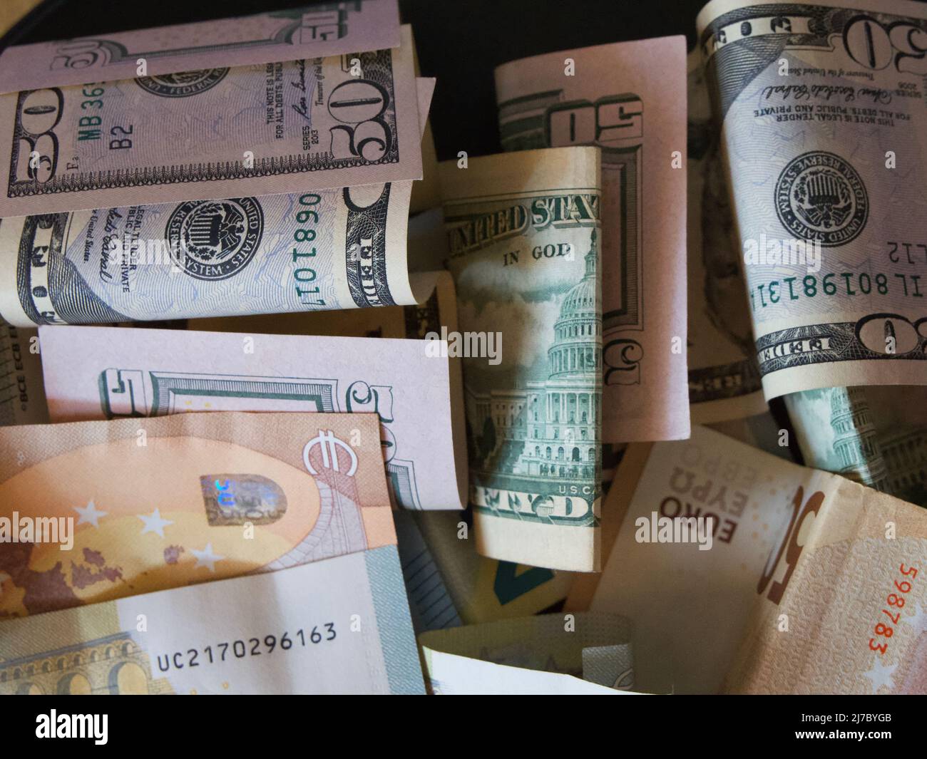 Cash banknotes dollars and euros are mixed up, a close-up shot Stock ...