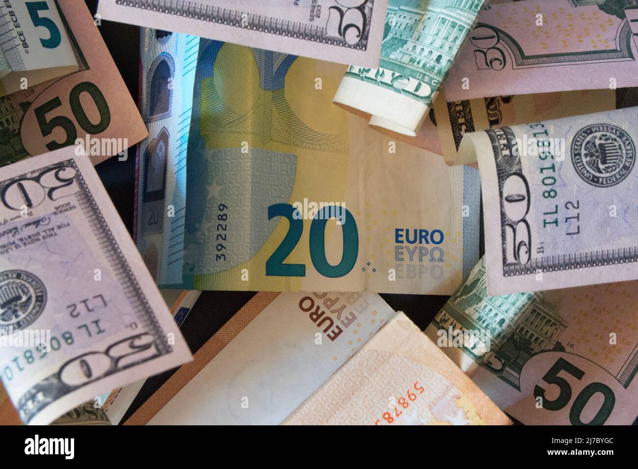 Cash banknotes dollars and euros are mixed up, a close-up shot Stock ...