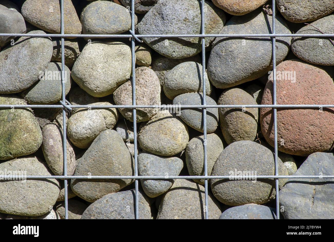 Gabion wall cages stones texture background Stock Photo - Alamy
