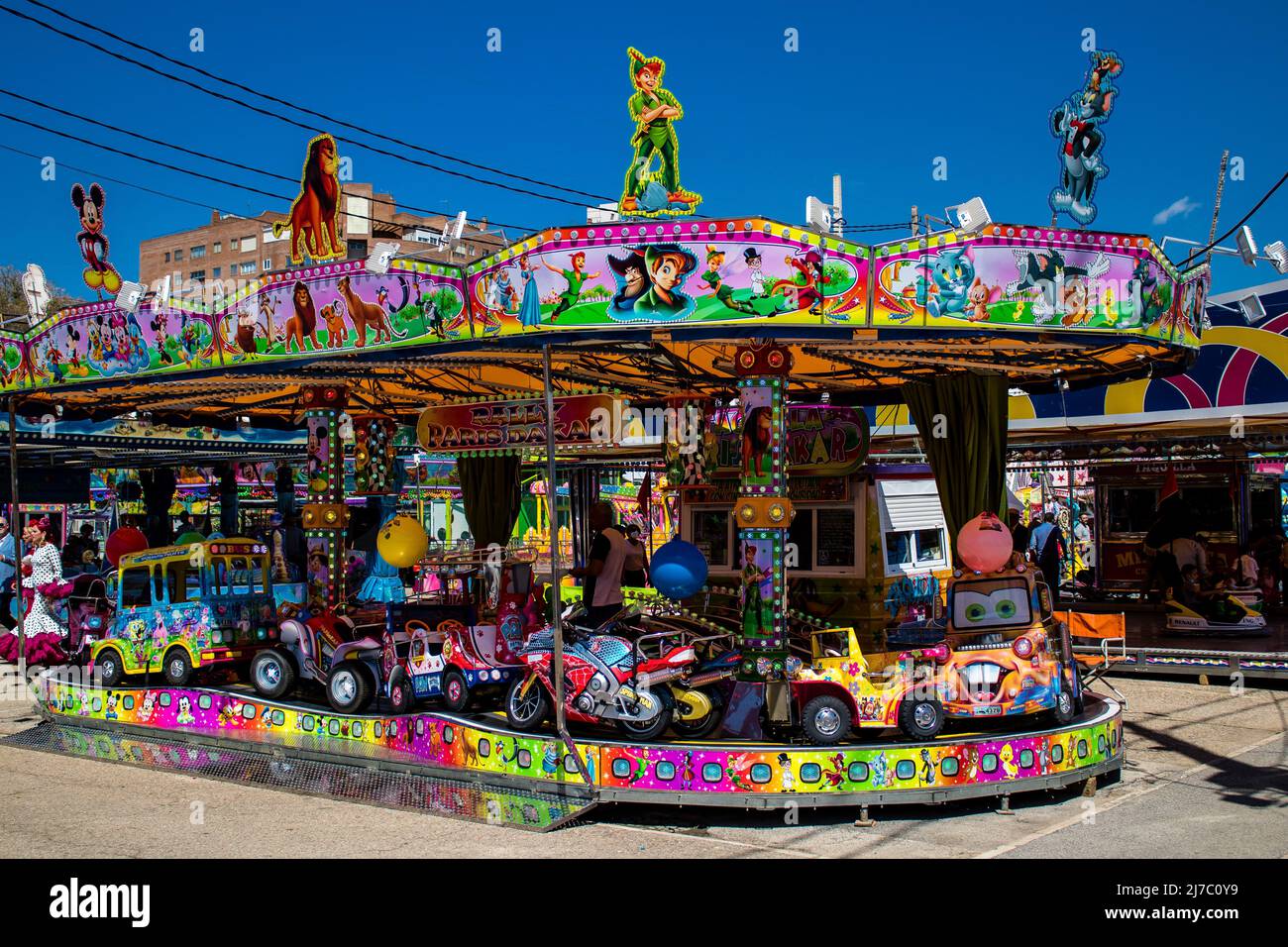 Seville, Spain - May 05, 2022 Feria de Sevilla funfair, the attractions ...