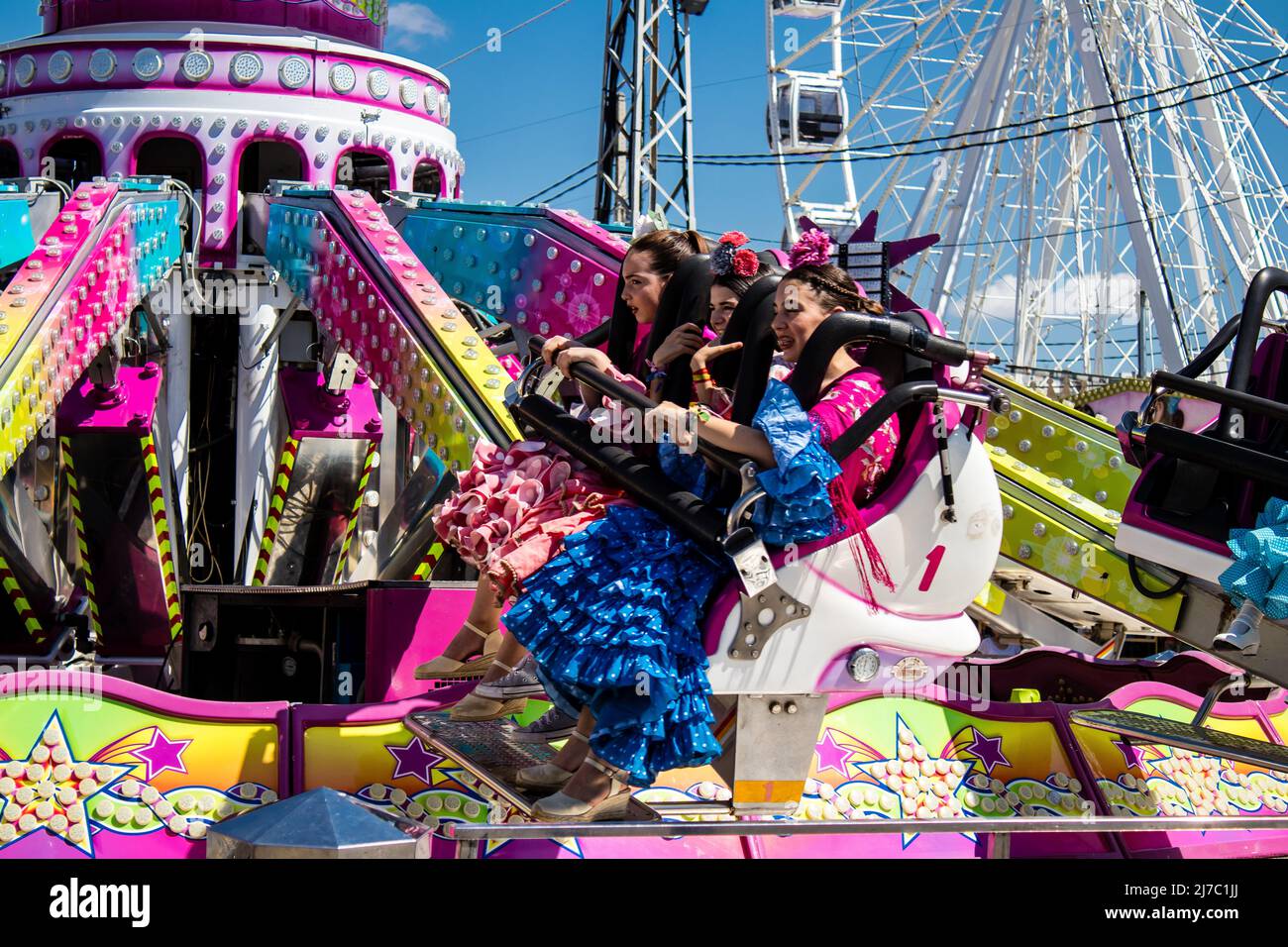 Seville, Spain - May 05, 2022 Feria de Sevilla funfair, the attractions ...