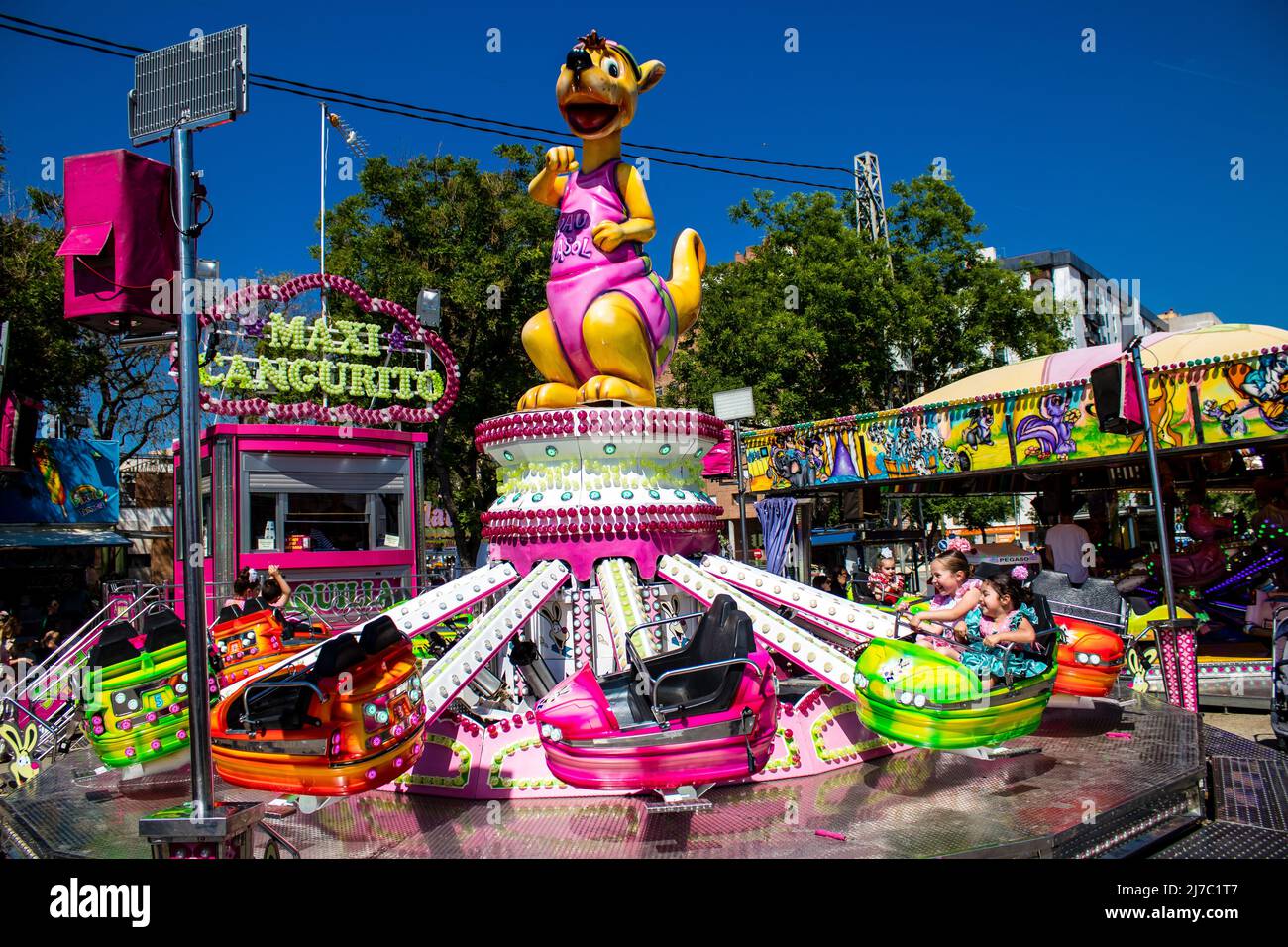 Seville, Spain - May 05, 2022 Feria de Sevilla funfair, the attractions ...