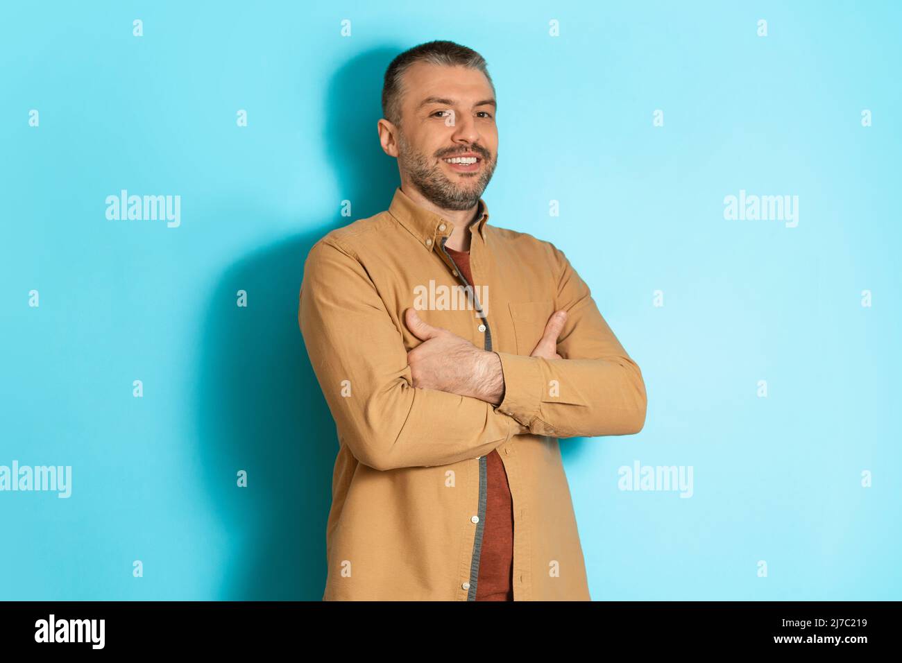 Handsome Middle Aged Man Standing Posing Over Blue Studio Background ...