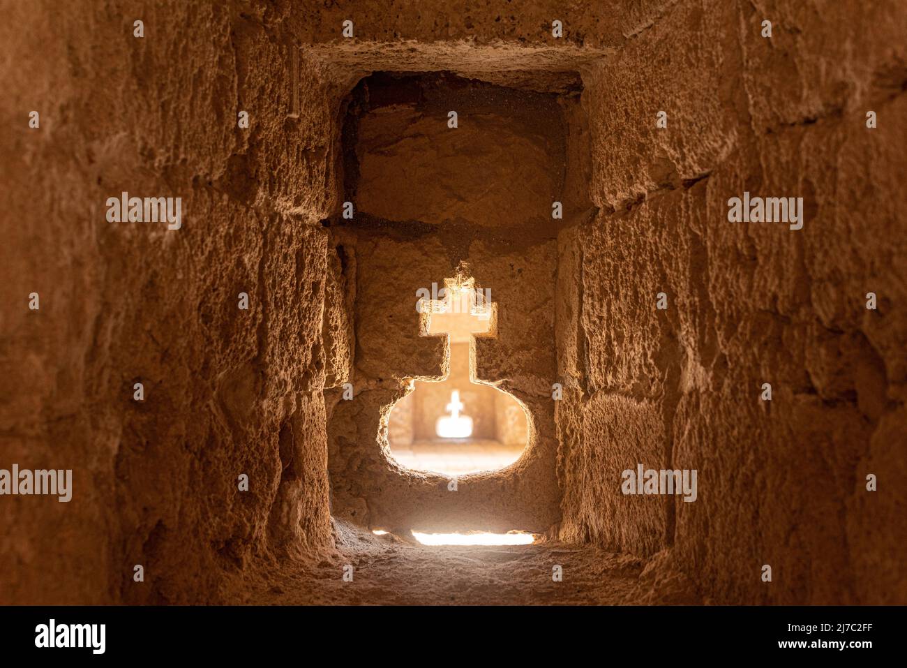 Divine cross in stone cave of ancient building Stock Photo - Alamy