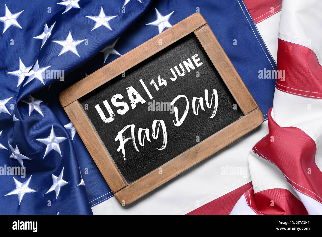 Chalkboard with text 14 JUNE, FLAG DAY on American flag, top view Stock ...