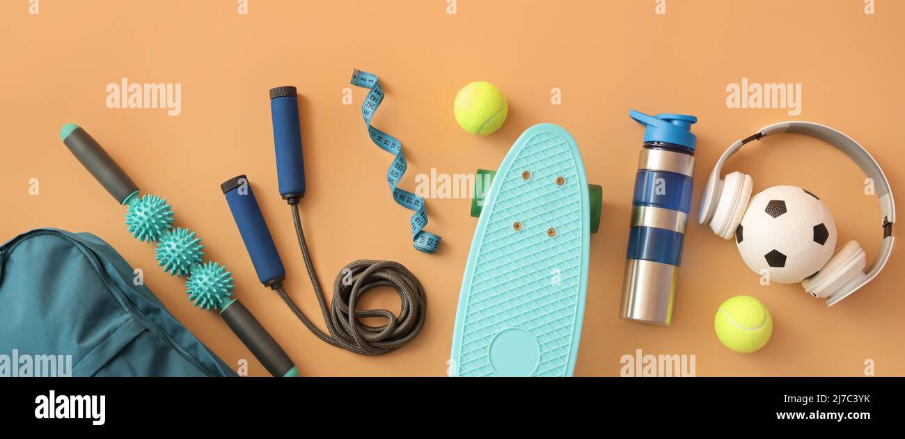Set of sport equipment on color background, top view Stock Photo - Alamy