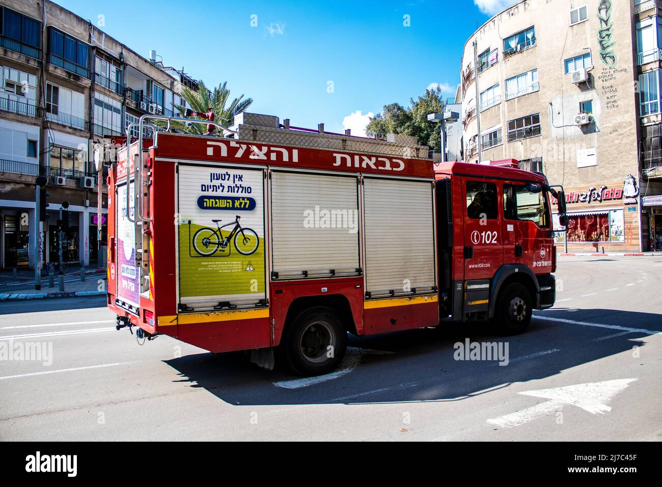 Tel Aviv, Israel - May 07, 2022 Fire engine driving through the streets ...