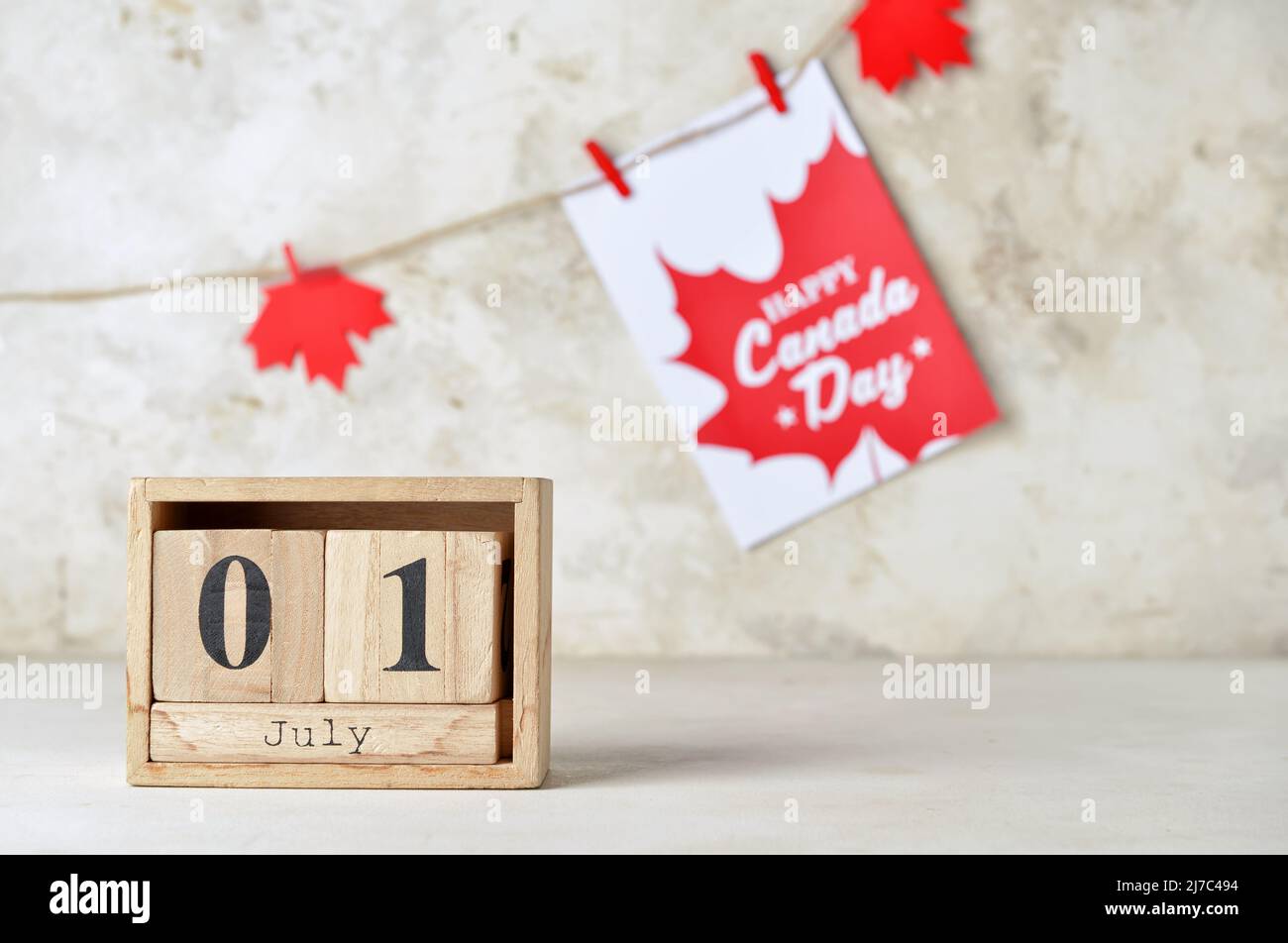 Wooden cube calendar with date JULY 1 on light background. Happy Canada ...