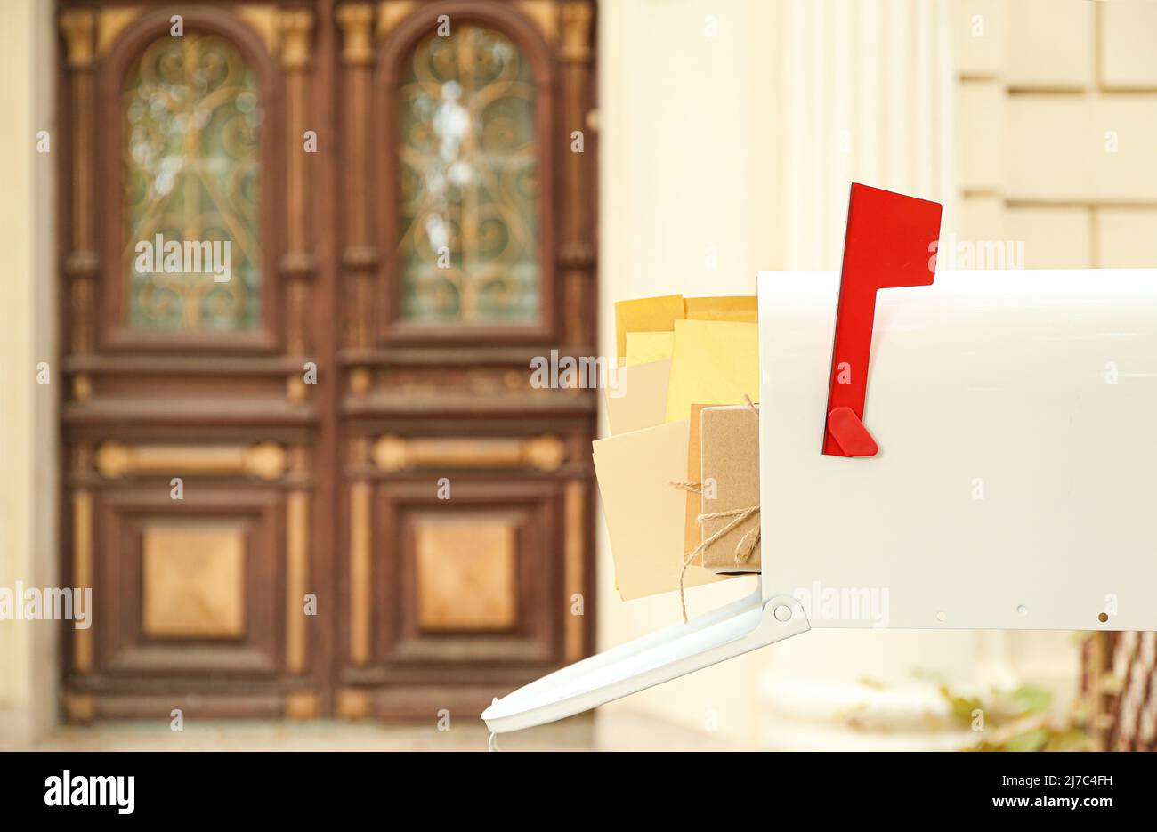 White mailbox with letters outdoors Stock Photo - Alamy