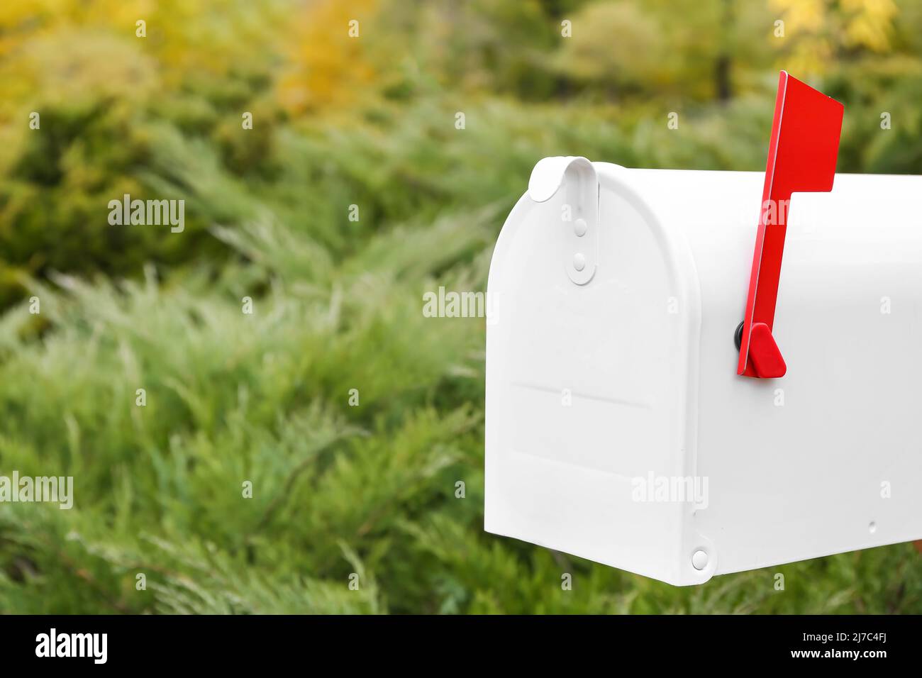White vintage mailbox with red flag Stock Photo - Alamy