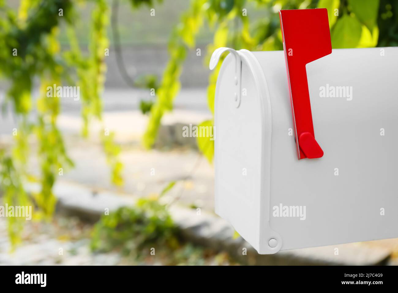 Mailbox with red flag outdoors Stock Photo - Alamy